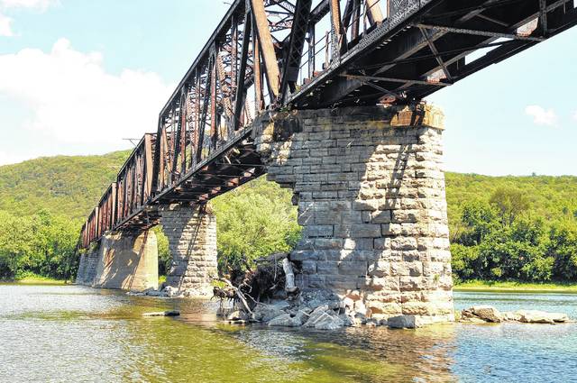 Contractor hired to tear down deteriorating Coxton railroad bridge over ...