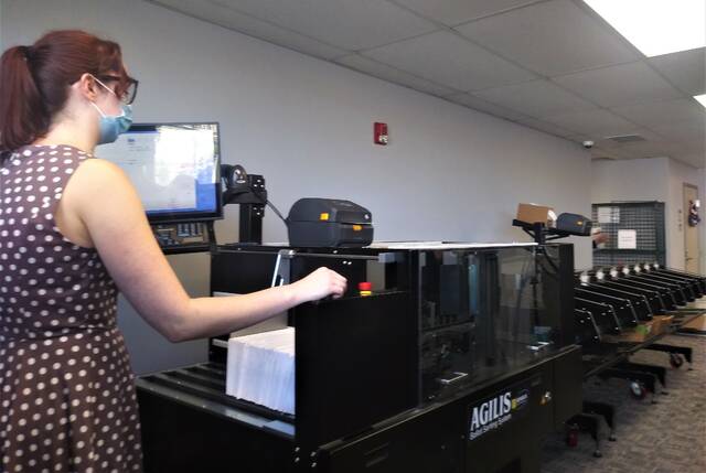 Luzerne County Election Bureau demonstrates new ballot sorting machine ...